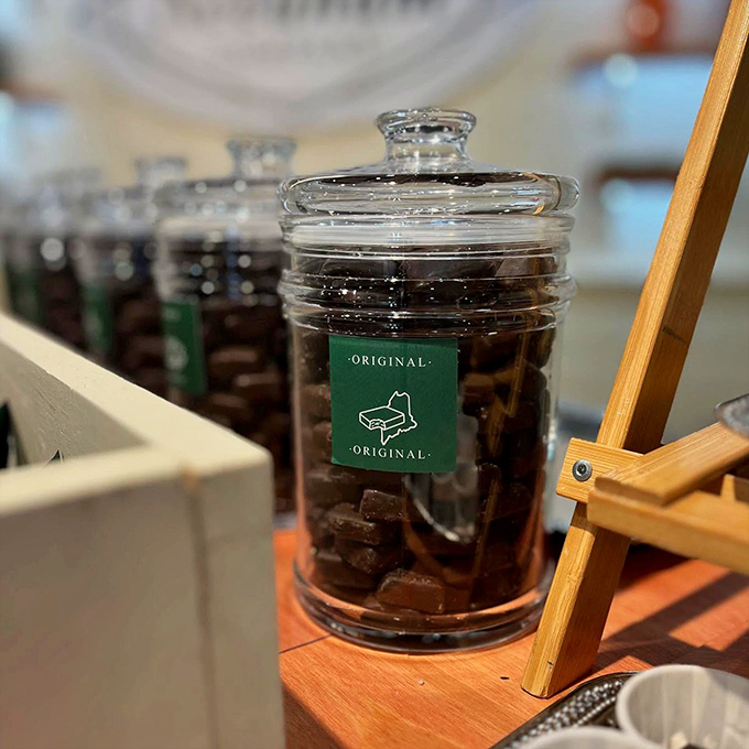 Glass jars filled with the original Needhams tempt visitors – each square promising the perfect balance of chocolate, coconut, and potato.