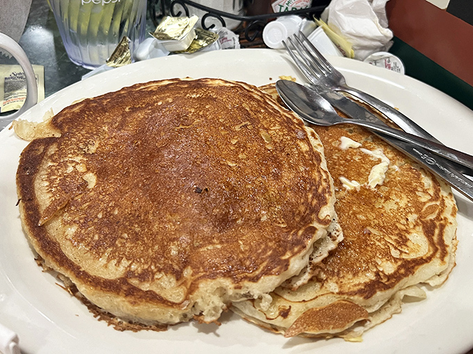 These pancakes aren't just big &ndash; they're "I need to recalculate my life choices" big, golden-brown discs of fluffy perfection.