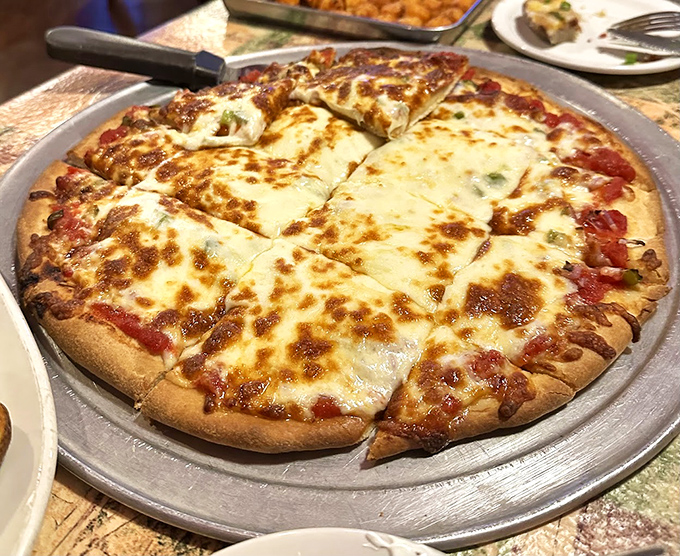Pizza perfection with a golden-brown crust and cheese that stretches dramatically with each slice &ndash; proof that The Grill House refuses to be typecast.