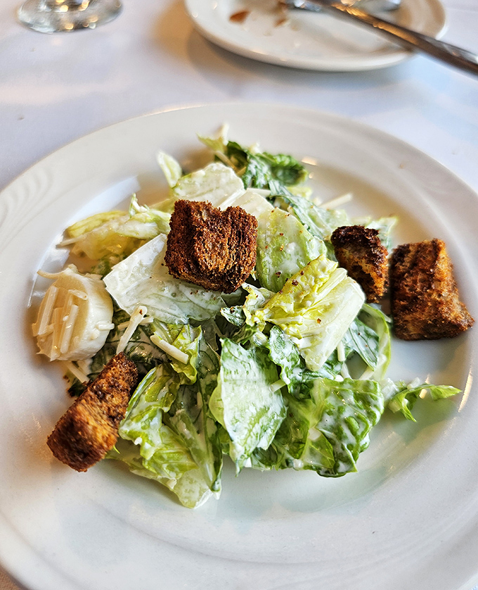 A crisp Caesar salad with hearts of palm provides a refreshing interlude between clues, the croutons as crunchy as the plot is thick.