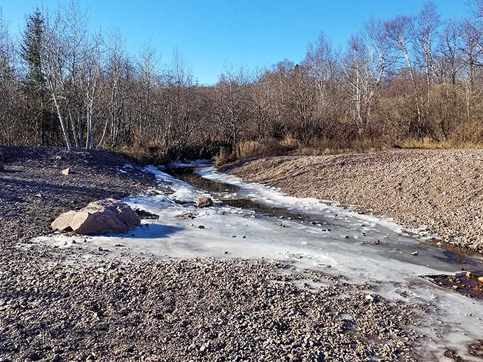 Winter's touch transforms Black Beach's streams into icy artworks, showcasing Minnesota's seasonal magic.