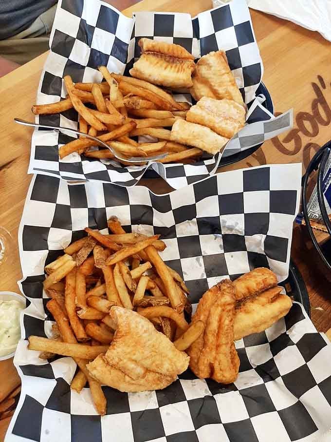 A checkered basket of golden treasures &ndash; whitefish and walleye fried to perfection, ready to transport you to flavor paradise.