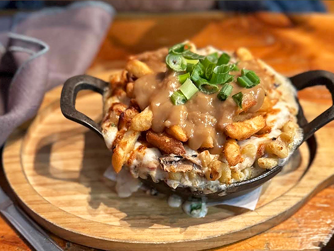 Poutine meets mac and cheese in this glorious mashup &ndash; crispy fries and pasta swimming together in a pool of cheesy decadence.