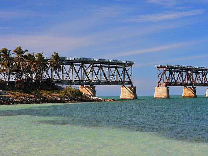 The iconic old railroad bridge at Bahia Honda frames the impossibly blue waters of the Keys, where engineering history meets natural beauty.