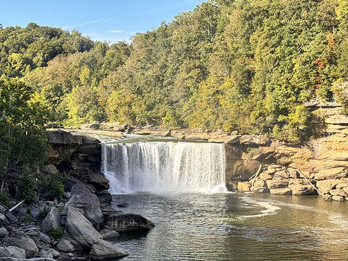 Cumberland Falls spreads wide across the Kentucky river, earning its nickname as the "Niagara of the South."