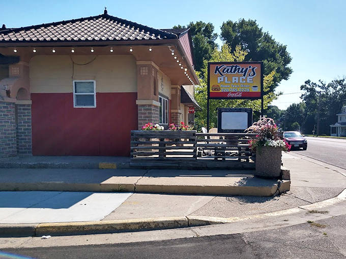 Kathy's Place's unique corner building with its distinctive architecture stands out in tiny Sacred Heart. The sunny patio invites diners to enjoy Minnesota's perfect summer days!