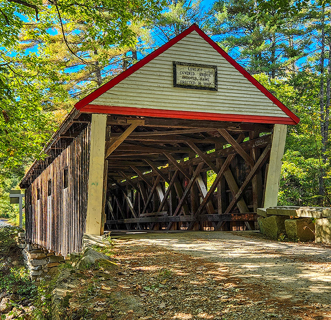 Lovejoy Bridge may be Maine's shortest covered bridge, but its white exterior with red trim makes a big impression against summer greenery.