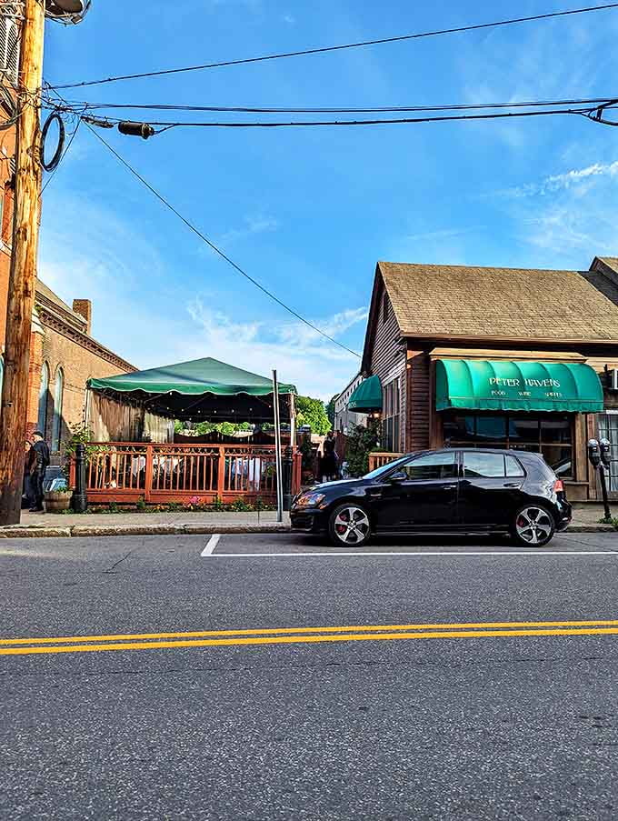 The charming streetside patio and historic building create a welcoming scene that practically begs you to stop for dinner.