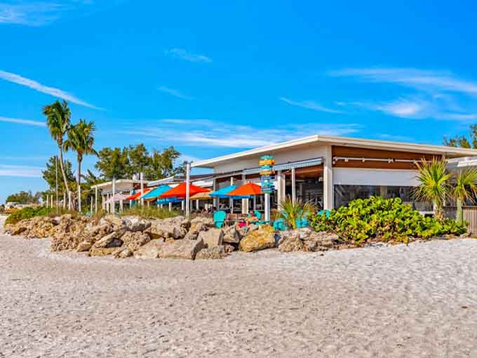 Colorful umbrellas and beachfront tables create an Instagram-worthy scene that tastes as good as it looks.