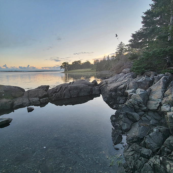 Where river battles ocean twice daily, creating swirling whirlpools and the illusion of water flowing uphill.