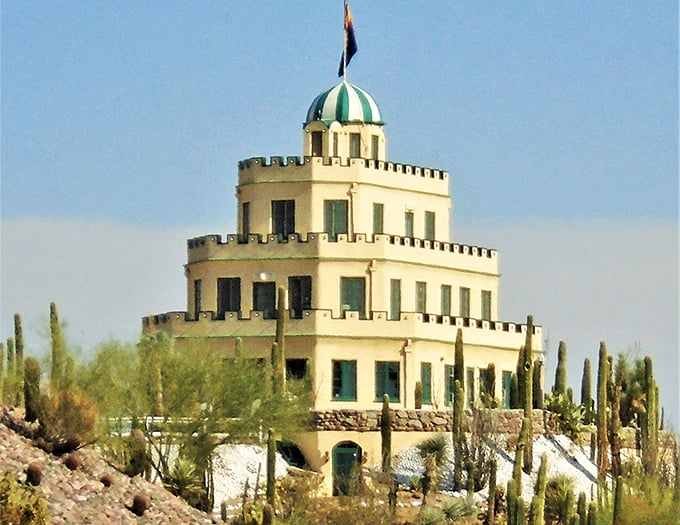 Tovrea Castle rises from the desert like a wedding cake made of stone, its distinctive tiered design creating an unexpected landmark.