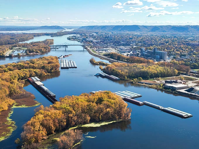 Winona's dramatic setting between towering bluffs and the Mississippi River creates one of Minnesota's most picturesque small towns.