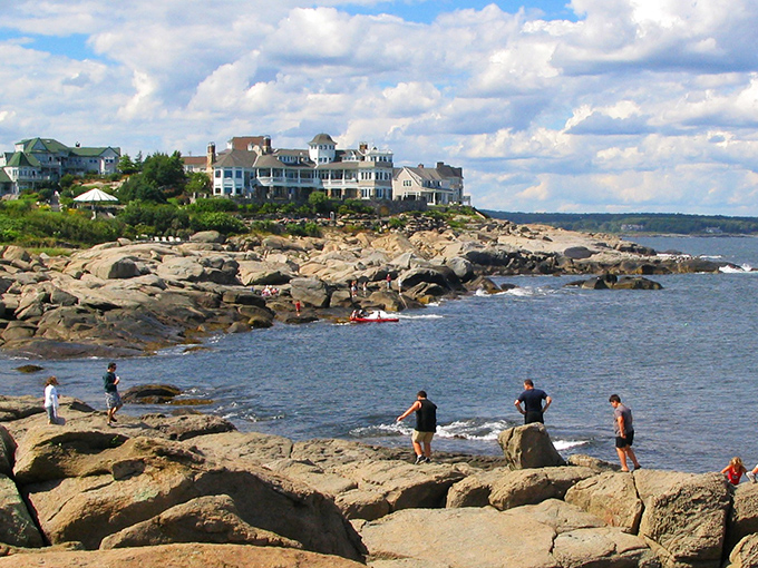 The rocky coastline of Cape Elizabeth offers dramatic ocean views where visitors perch like seabirds to watch waves crash against Maine's shore.