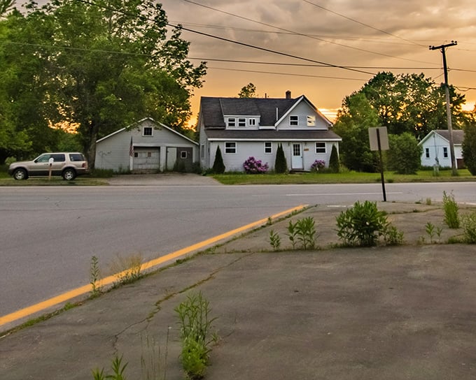 Golden hour settles gently over a small-town road. Main streets, soft sunsets, and that small-town feeling.