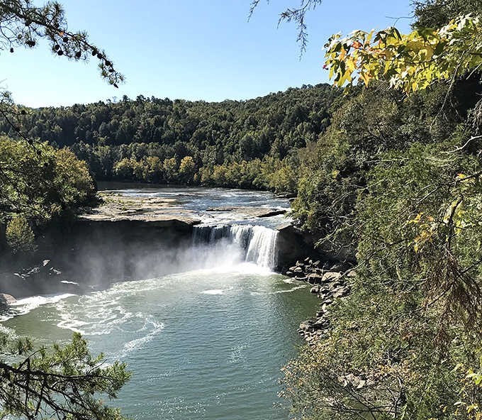 The perfect vantage point captures Cumberland's impressive width and drop, surrounded by the lush forests of eastern Kentucky.
