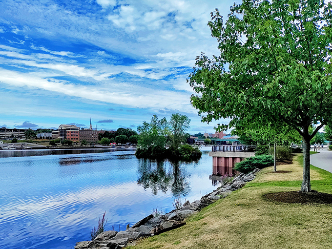 Tranquil waters reflect mountains and sky in this pristine Maine landscape that transforms completely when winter isolation sets in.