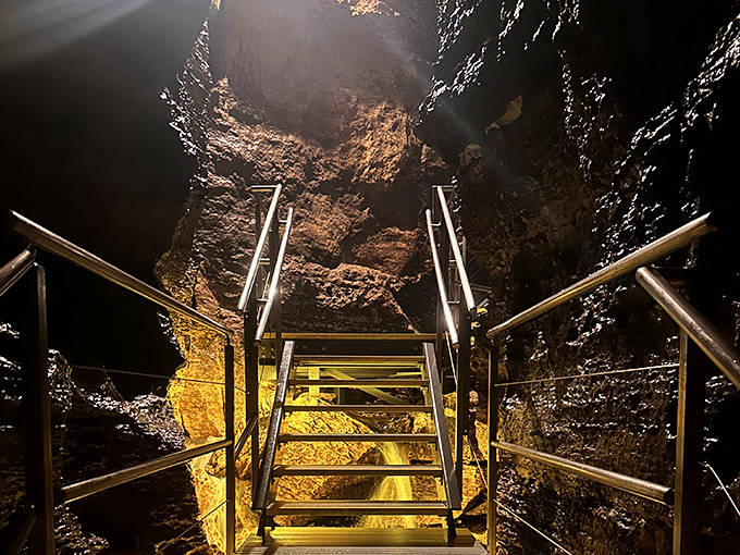 Golden light illuminates ancient rock formations in Niagara Cave, revealing a hidden world shaped by water one drop at a time.
