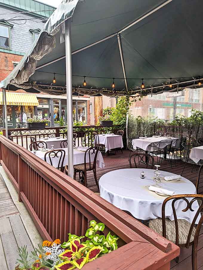 White tablecloths and elegant outdoor seating create a refined atmosphere that's still relaxed enough for comfortable family dining.
