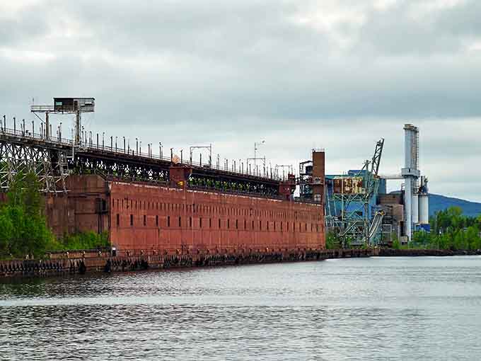 The scale of abandonment impresses at Taconite Harbor, where enormous industrial structures stand silent against Superior's vast waters.