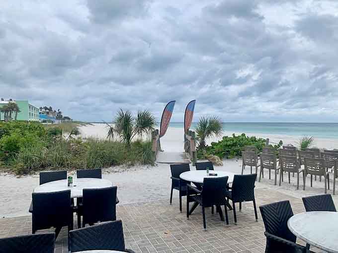When the restaurant puts tables directly on the sand, they're basically daring you not to kick off your shoes.