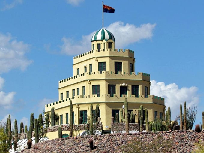 The "Wedding Cake Castle" stands proudly against the Arizona sky, surrounded by thousands of cacti in one of Phoenix's most unusual landmarks.