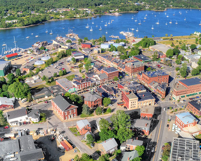 An aerial view reveals Belfast's perfect positioning where river meets bay, creating the natural harbor that shaped its destiny.