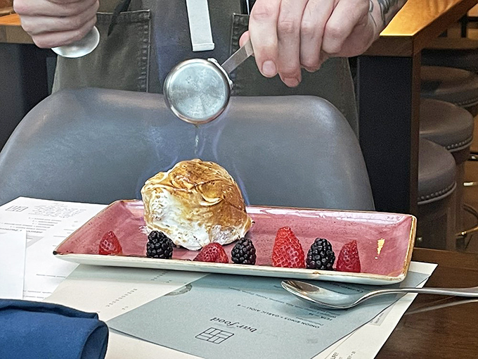 Fire meets ice in this theatrical finale &ndash; a torched meringue igloo protecting creamy ice cream, surrounded by nature's candy of fresh berries.