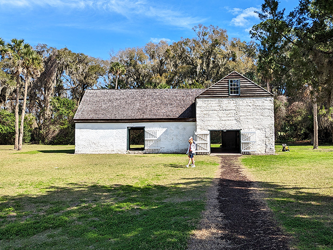 This historic barn at Kingsley Plantation has weathered centuries of Florida storms, its whitewashed walls telling stories of agricultural innovation and human labor.