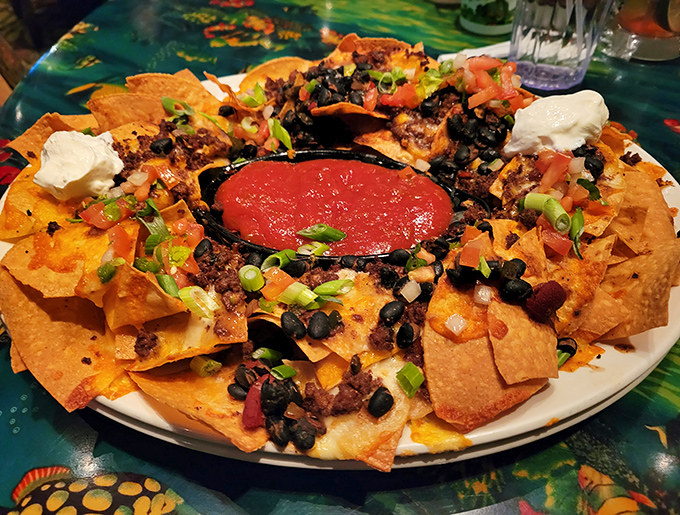 Volcanic in appearance and flavor, these loaded nachos create a mountain of cheese, beans, and beef that requires a team expedition to conquer.