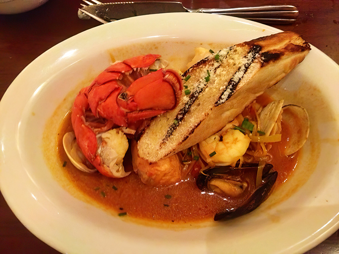 This bouillabaisse isn't just soup &ndash; it's an oceanic symphony in a bowl, complete with that grilled bread for capturing every last drop.