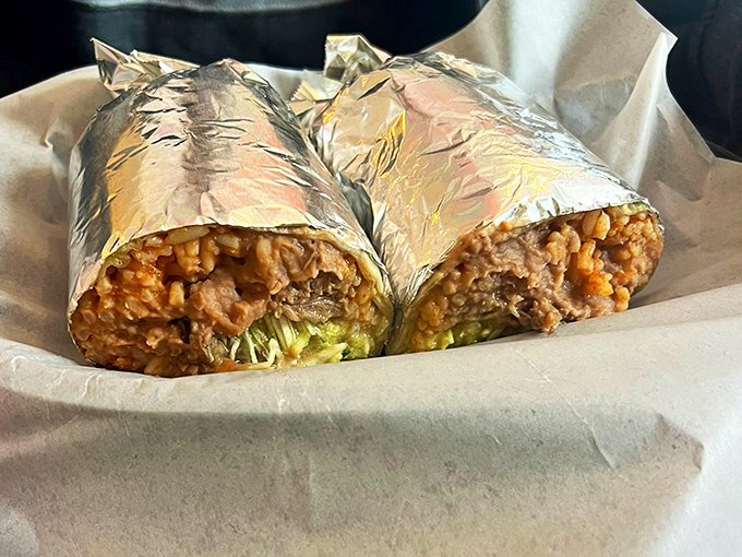 Behold the burrito – where rice, beans, and perfectly seasoned meat live harmoniously wrapped in a warm tortilla embrace.