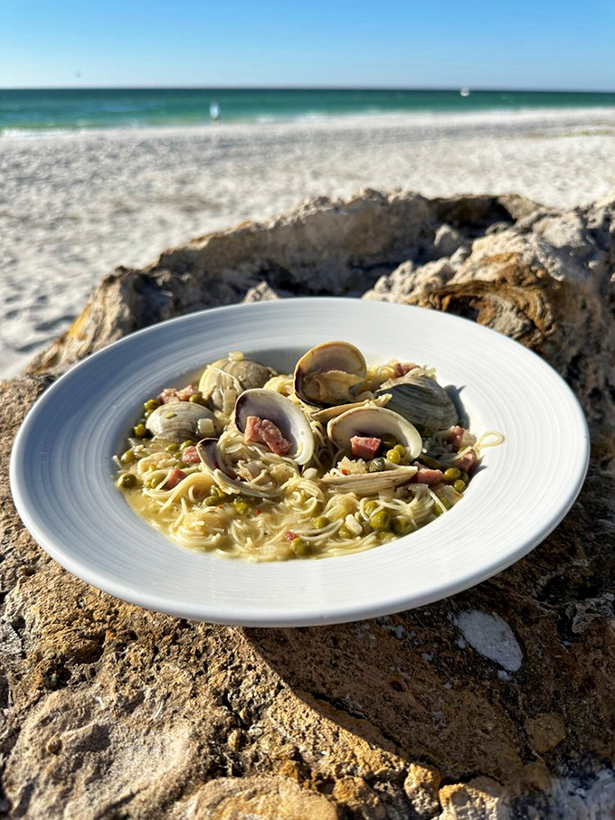 Capellini: Delicate pasta cradles tender clams in a broth so flavorful, you'll be tempted to drink it like a soup.