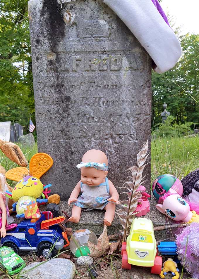 Alfreda's grave has become a makeshift shrine where visitors leave toys and trinkets, believing the child's spirit still plays among the headstones.