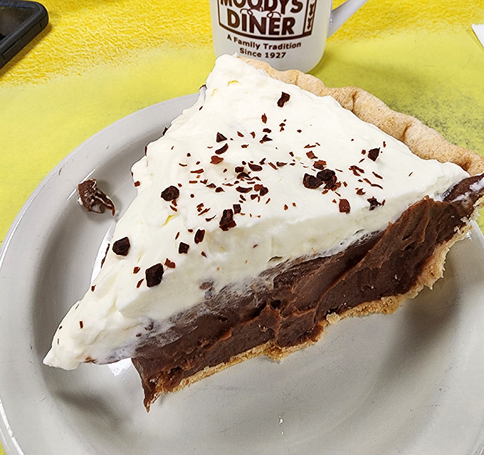 Chocolate cream pie topped with a cloud of whipped cream &ndash; the kind of dessert that silences conversation at the table.