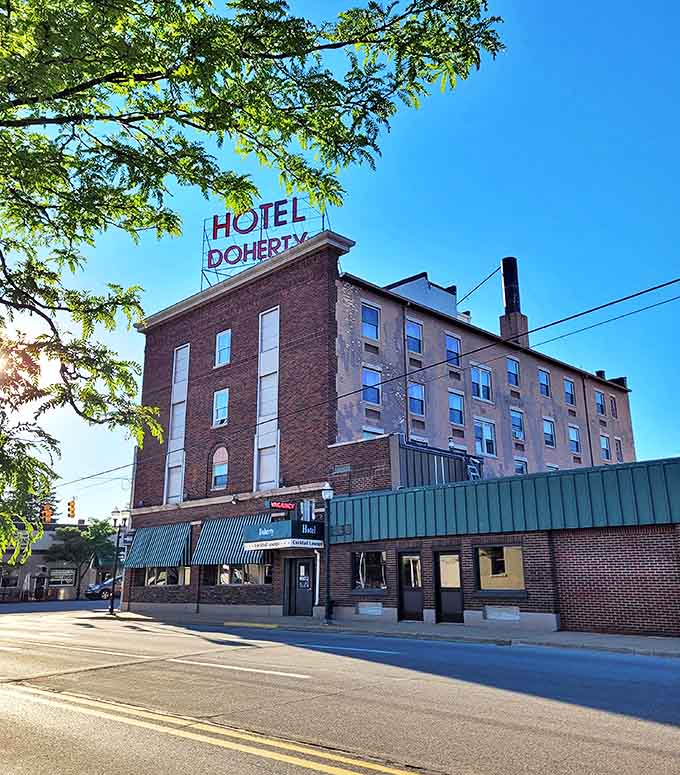 From this angle, the hotel's historic character is on full display, from the classic brick fa&ccedil;ade to the iconic rooftop sign that's guided travelers for decades.