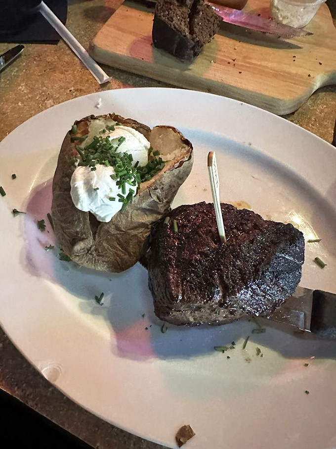 When your filet mignon needs its own toothpick flag, you know you're in for something special. That baked potato looks ready for its close-up too!