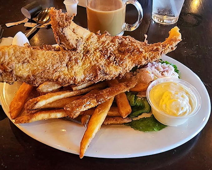 Fish and chips that would make a New Englander weep with joy &ndash; crispy batter, flaky white fish, and fries that deserve their own fan club.