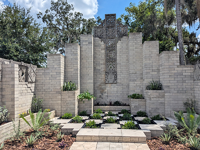 The Chapel Garden's geometric concrete cross rises dramatically skyward &ndash; a modernist meditation space that transcends religious boundaries.