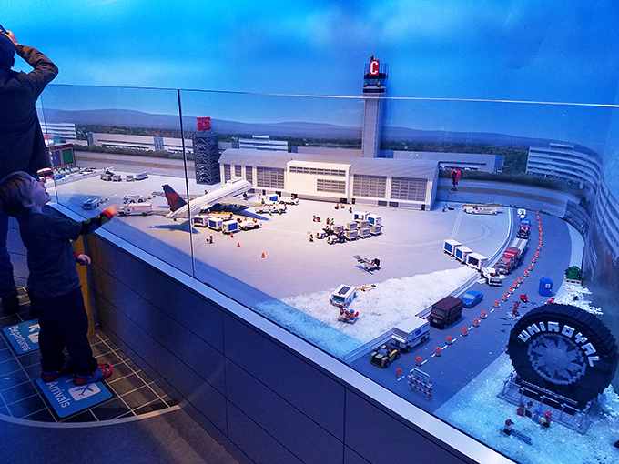 The airport scene features incredible moving planes and vehicles, making you wonder if the TSA agents are just as thorough when they're made of plastic.