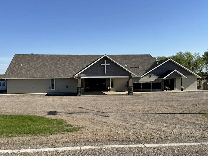 Contemporary Lutheran church with clean lines and prominent cross, serving as both spiritual center and community anchor.