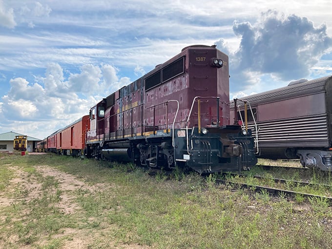 This weathered maroon locomotive has seen decades of rail service, its industrial charm a testament to American engineering prowess.