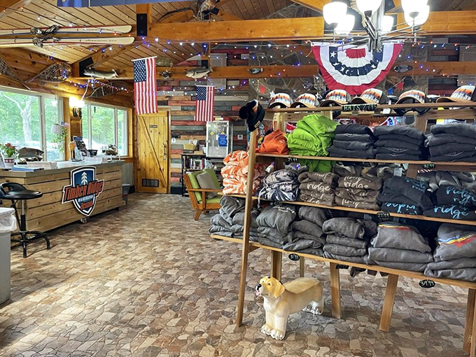 The merchandise area offers tangible memories to take home, because sometimes "I survived camping in comfort" deserves a commemorative t-shirt.