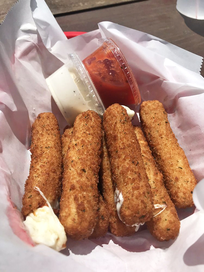 Mozzarella sticks with that perfect cheese pull, the culinary equivalent of winning the lottery when that first stretchy bite hits your palate.