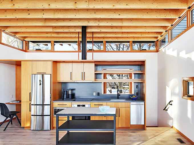 This kitchen means business, with sleek cabinetry and modern appliances that make you want to cook even if your usual specialty is takeout menus.