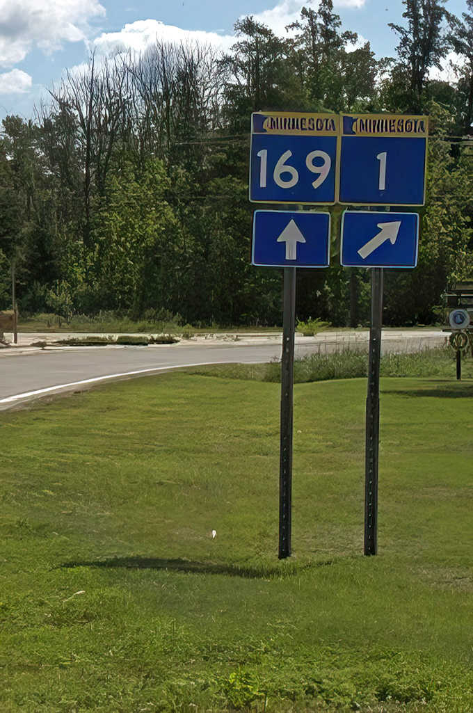 Blue and yellow Minnesota highway signs stand as friendly sentinels, guiding adventurers through the state's most scenic corridors.
