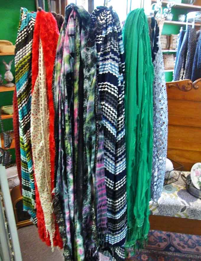 A rainbow of scarves cascades in various patterns and textures, tempting shoppers to add a splash of color to winter wardrobes.