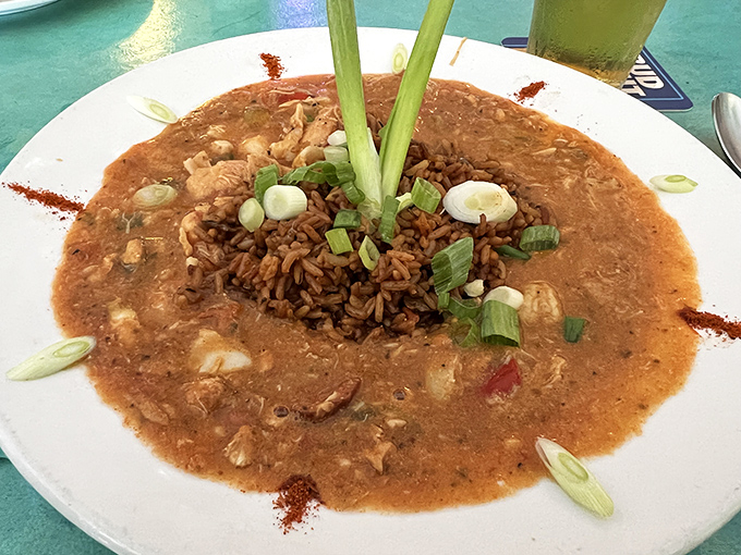 Rice island rising from a flavorful sea of gumbo, garnished with green onions &ndash; this dish makes Louisiana natives nod in respectful approval.