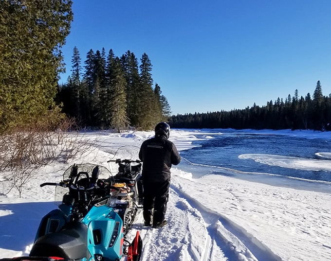 Winter transforms the Allagash into a snowmobiler's paradise, where frozen lakes become highways to hidden history.