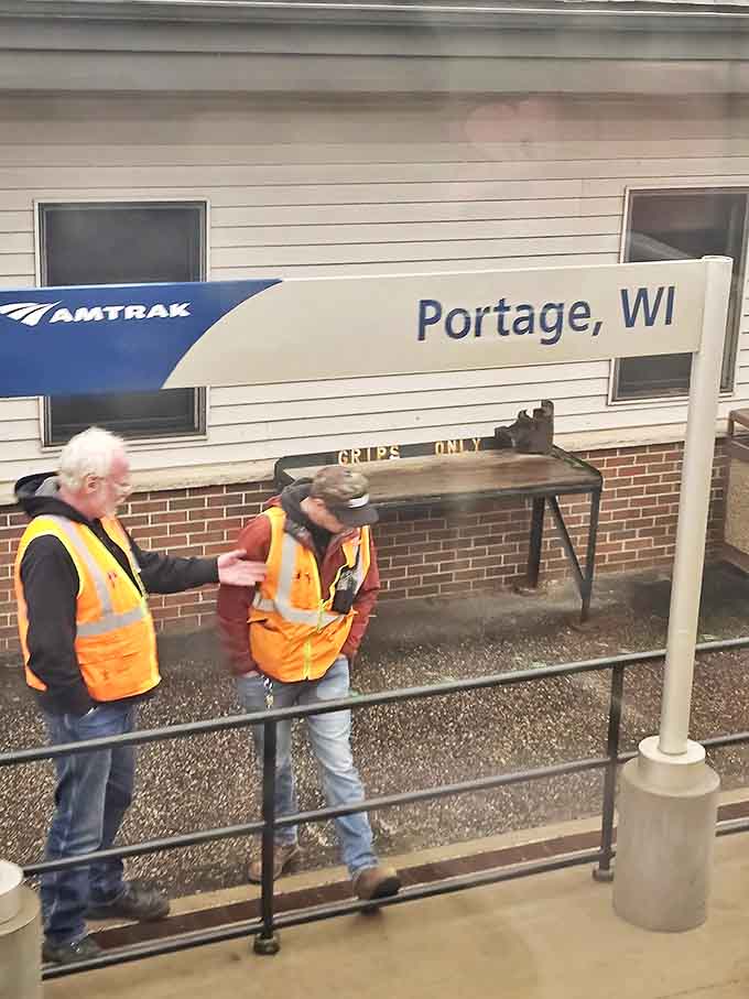All aboard! Station staff ensure smooth departures, keeping Wisconsin's rail tradition alive one friendly wave at a time.
