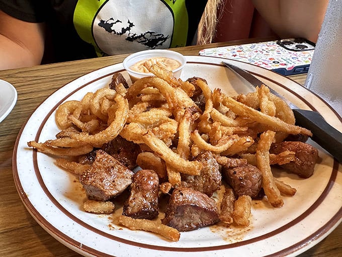 Steak bites and crispy onion tanglers offer the perfect shareable plate for those wanting flavor without the full burger commitment.